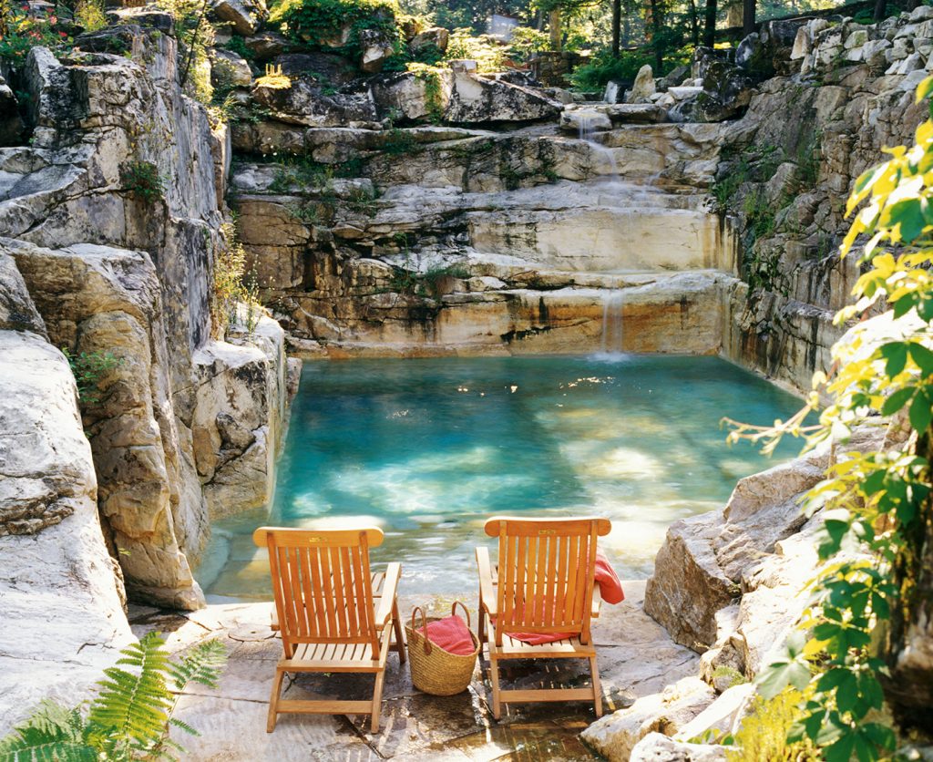 Natural Backyard Swimming Pool Converted from an Old Limestone Quarry