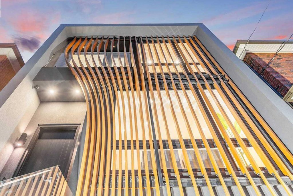 Unique Modern Home with Motorized Wavy Wooden Curtain Façade