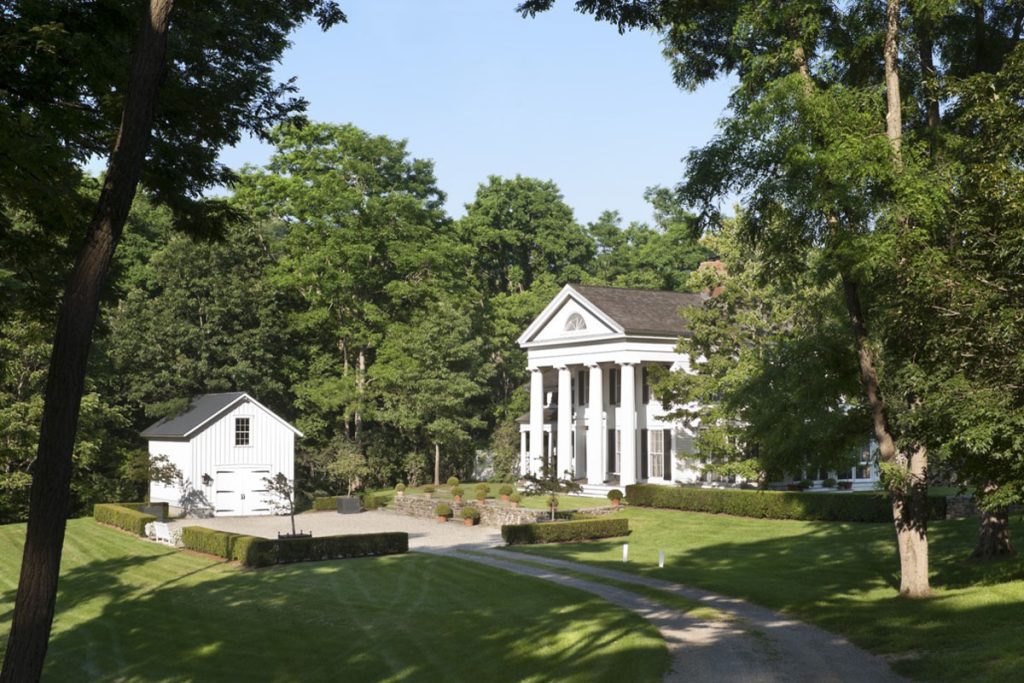 Classic Greek Revival House on a Wooded Hillside
