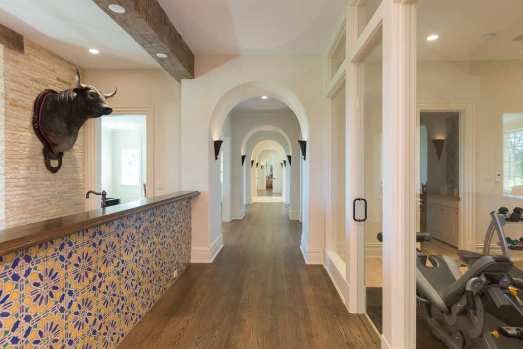 Riverfront Limestone Estate Inspired by Spanish Aragon Architecture