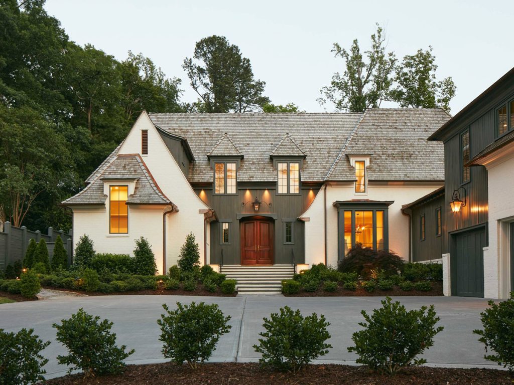 Urban Retreat with Modern Tudor Style Transitional Architecture