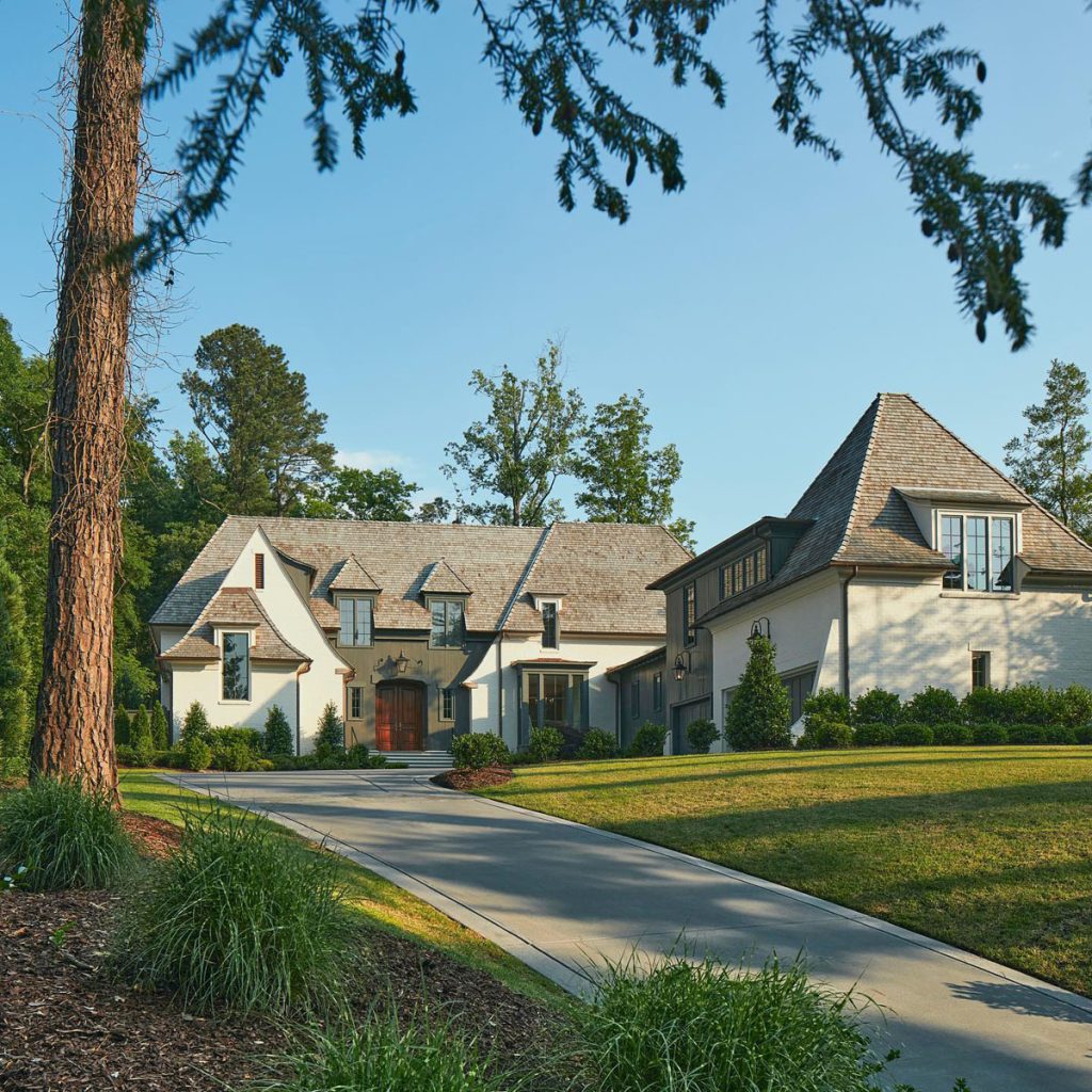 Urban Retreat with Modern Tudor Style Transitional Architecture