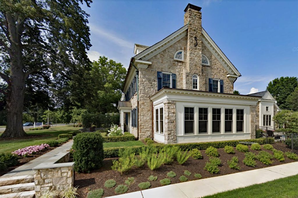 Historic Riverfront Stone House with Traditional Landscaping