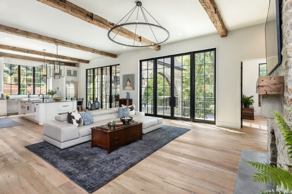 Modern Tudor Style Home Blends into Forested Surroundings