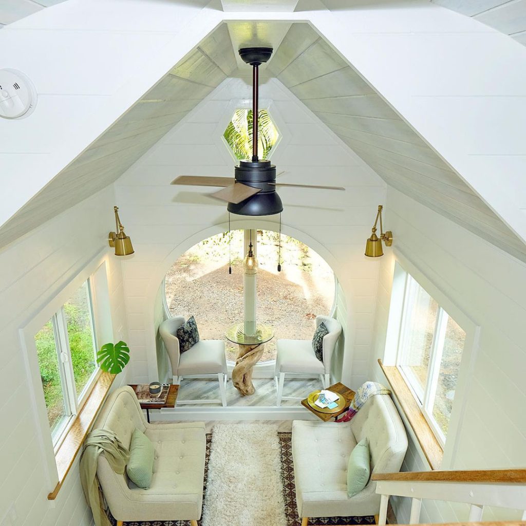 Unique Tiny House on Wheels with Large Round Window
