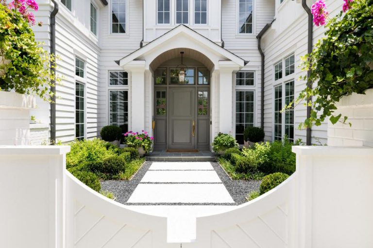 White Gate and Walkway Add Curb Appeal to Traditional Home