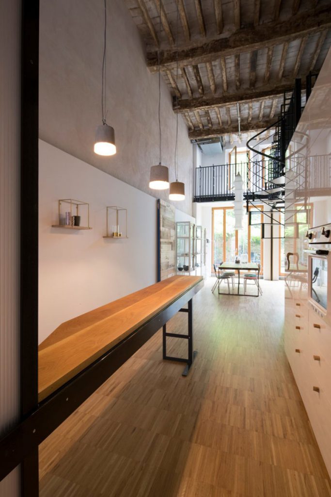 An Old Workshop Transformed into a Double Height Residence with ...