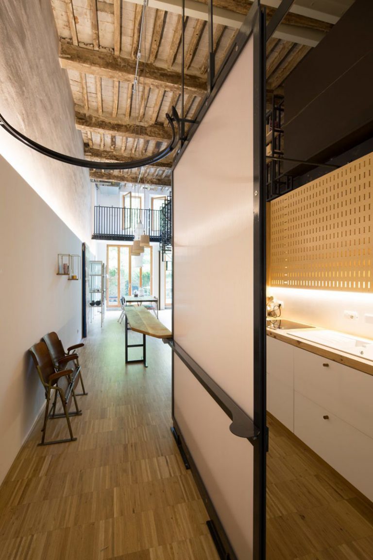 An Old Workshop Transformed into a Double Height Residence with ...