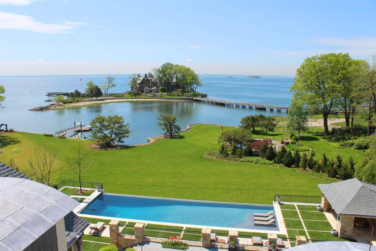 Waterfront Stone Mansion with French Country Architecture