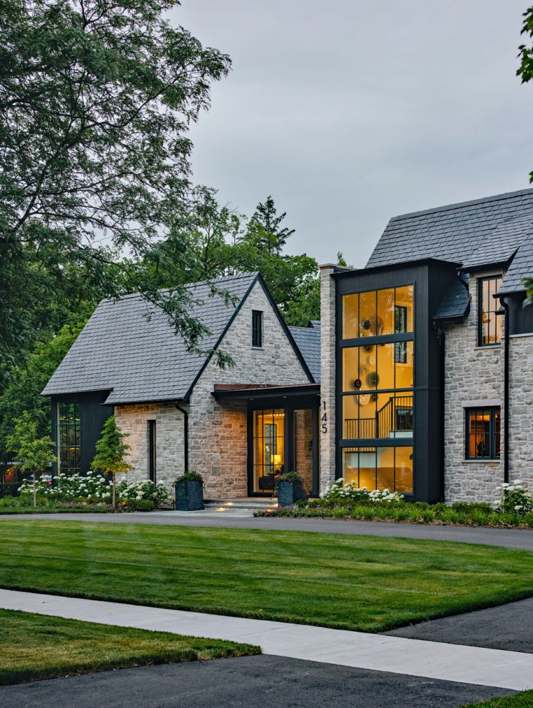 Modern Suburban Stone and Glass House with Timeless Appeal