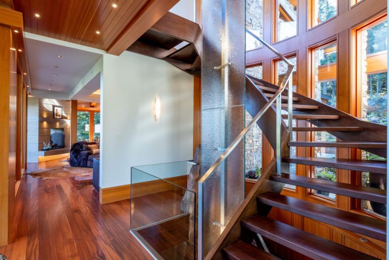 Iconic Waterfall House Built Into a Stone Cliff in Whistler