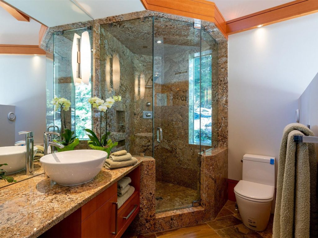 Iconic Waterfall House Built Into a Stone Cliff in Whistler