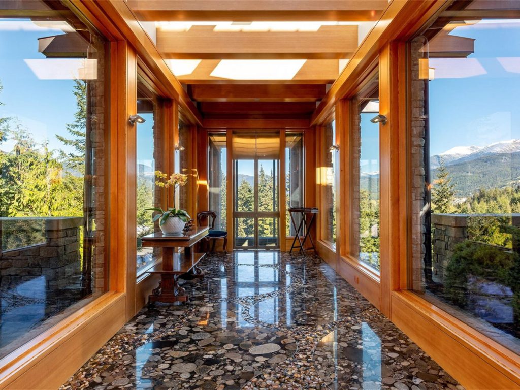 Iconic Waterfall House Built Into a Stone Cliff in Whistler