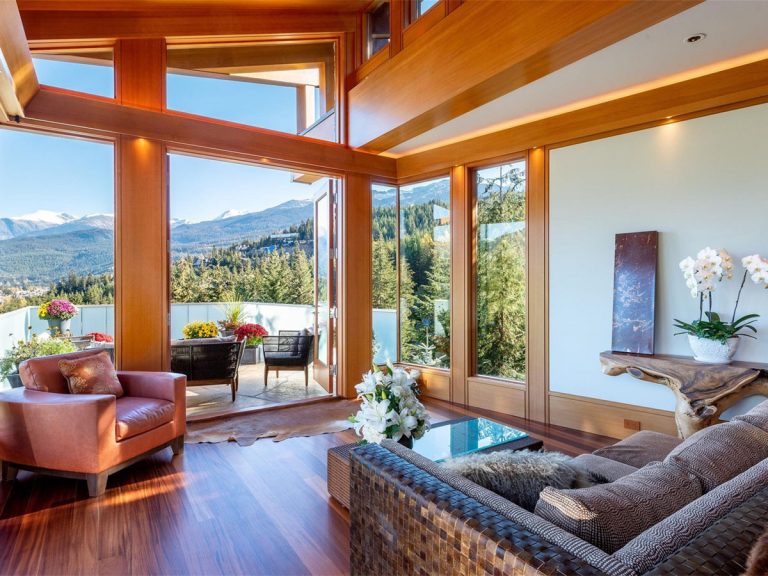 Iconic Waterfall House Built Into a Stone Cliff in Whistler
