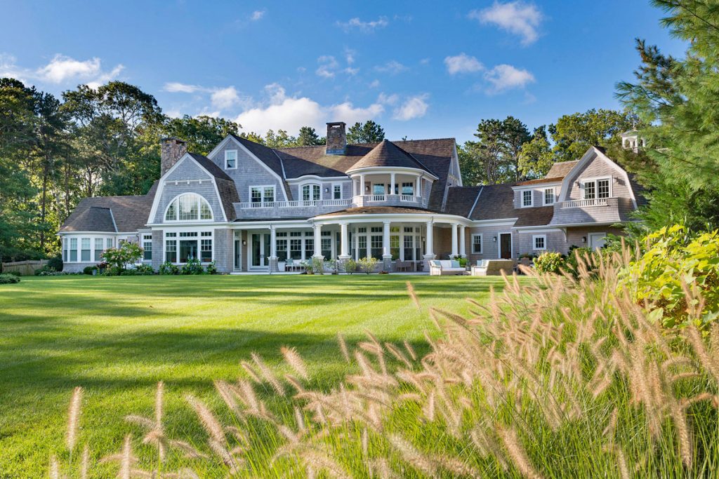 Shingle Style Cape Cod Home with Porches and Classical Columns
